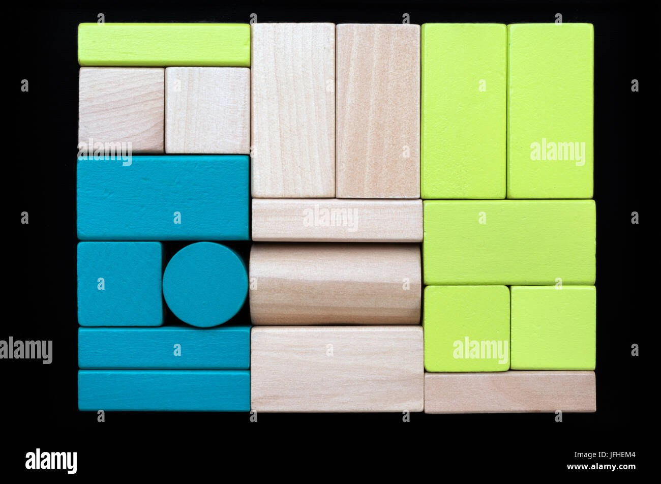 Sorted wooden blocks on black background Stock Photo - Alamy