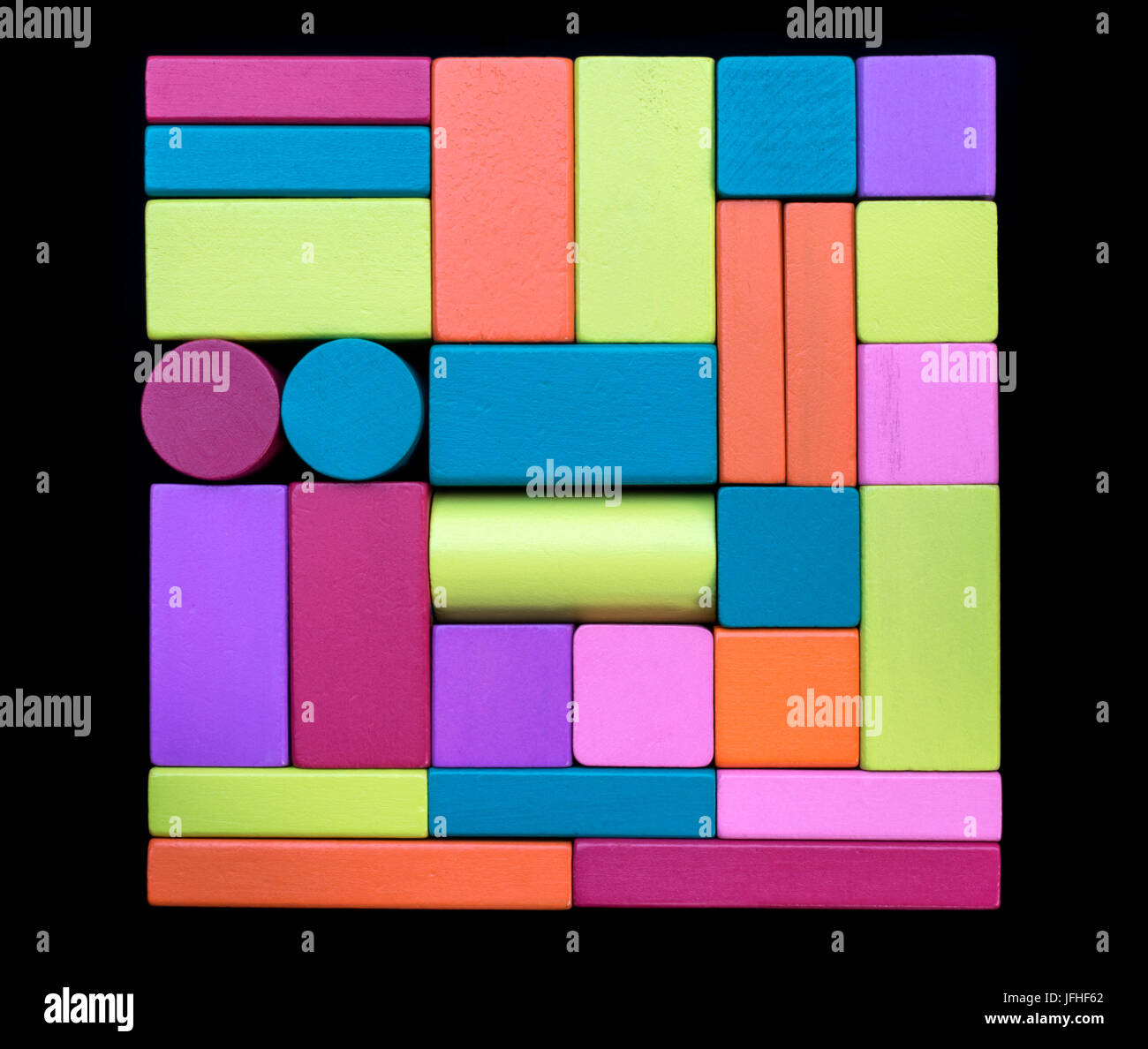 Colourful wooden blocks sorted on black background Stock Photo - Alamy