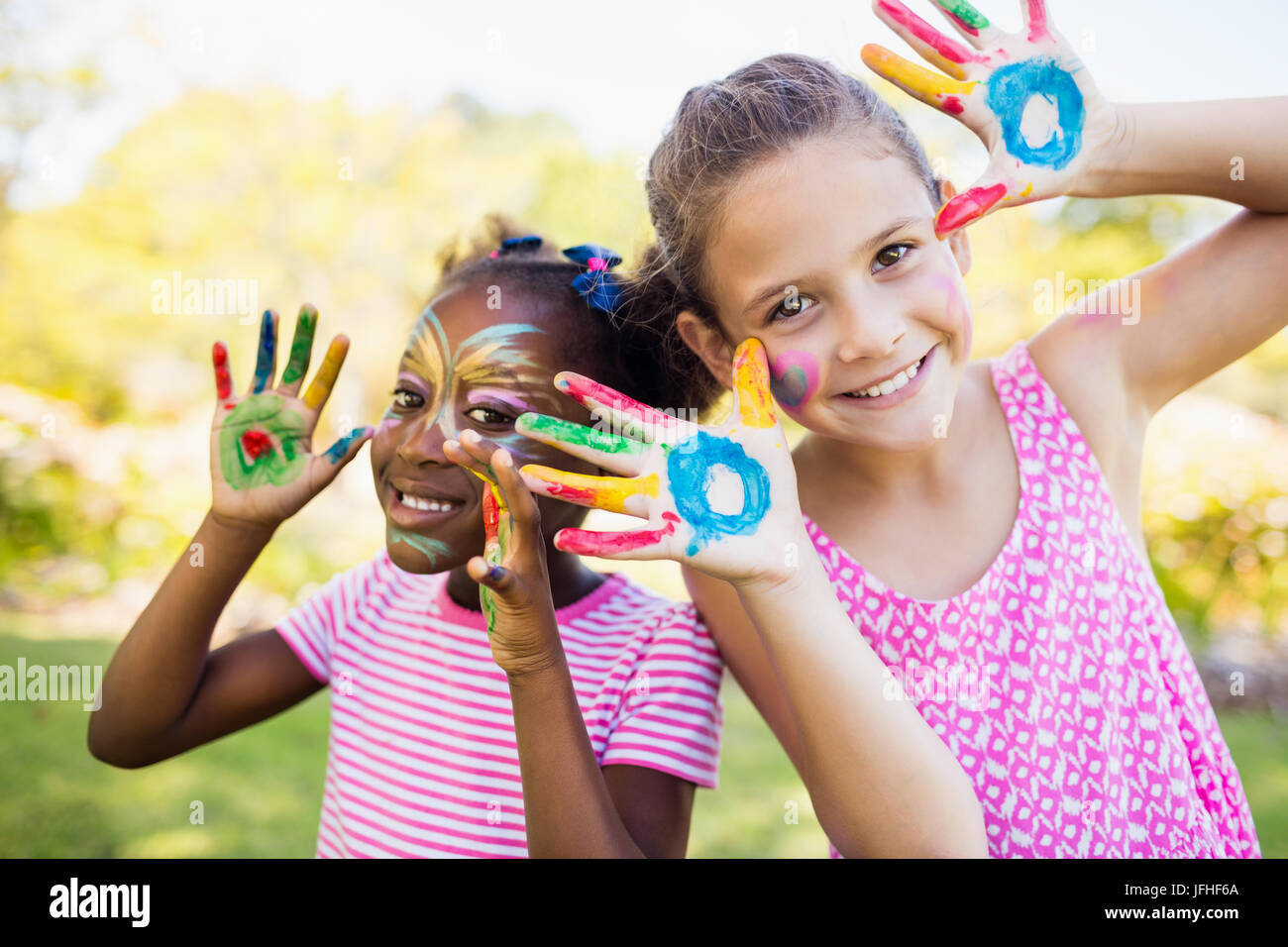 Portrait of cute girls with make up having coloured hands Stock Photo ...