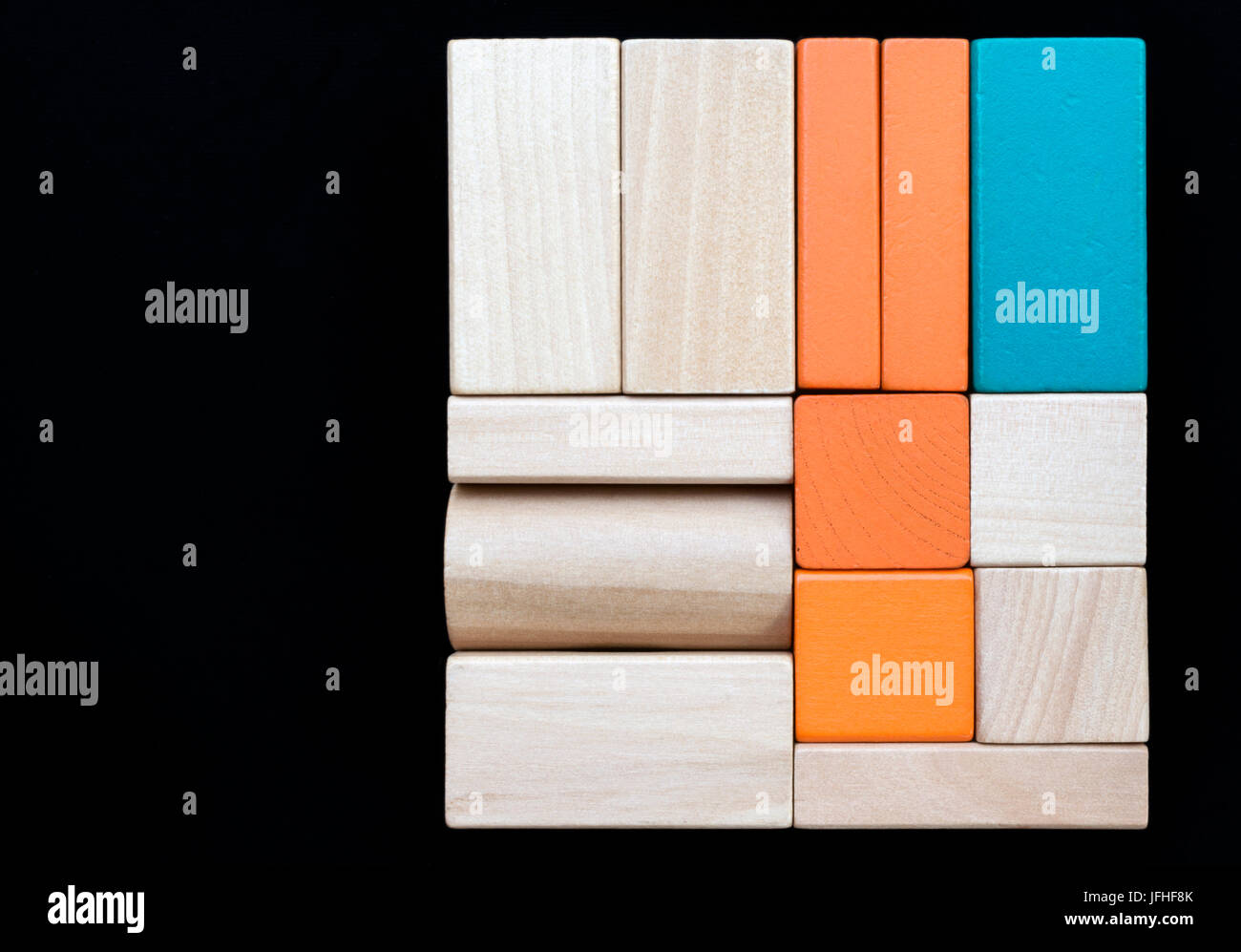 Sorted wooden blocks on black background. Copy space Stock Photo - Alamy