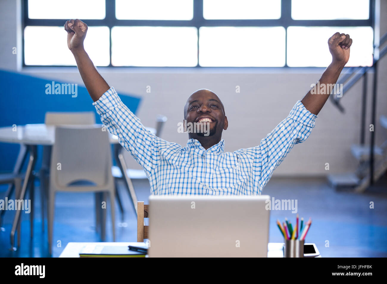 Businessman arms up celebrating victory hi-res stock photography and ...