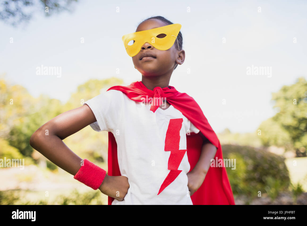 Portrait of cute girl pretending to be a superhero Stock Photo - Alamy