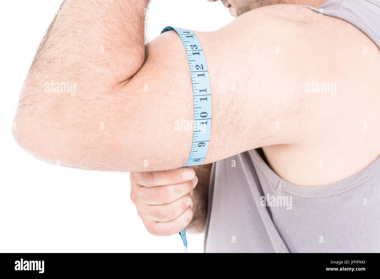Close-up of athlete measuring his biceps with measuring tape Stock ...