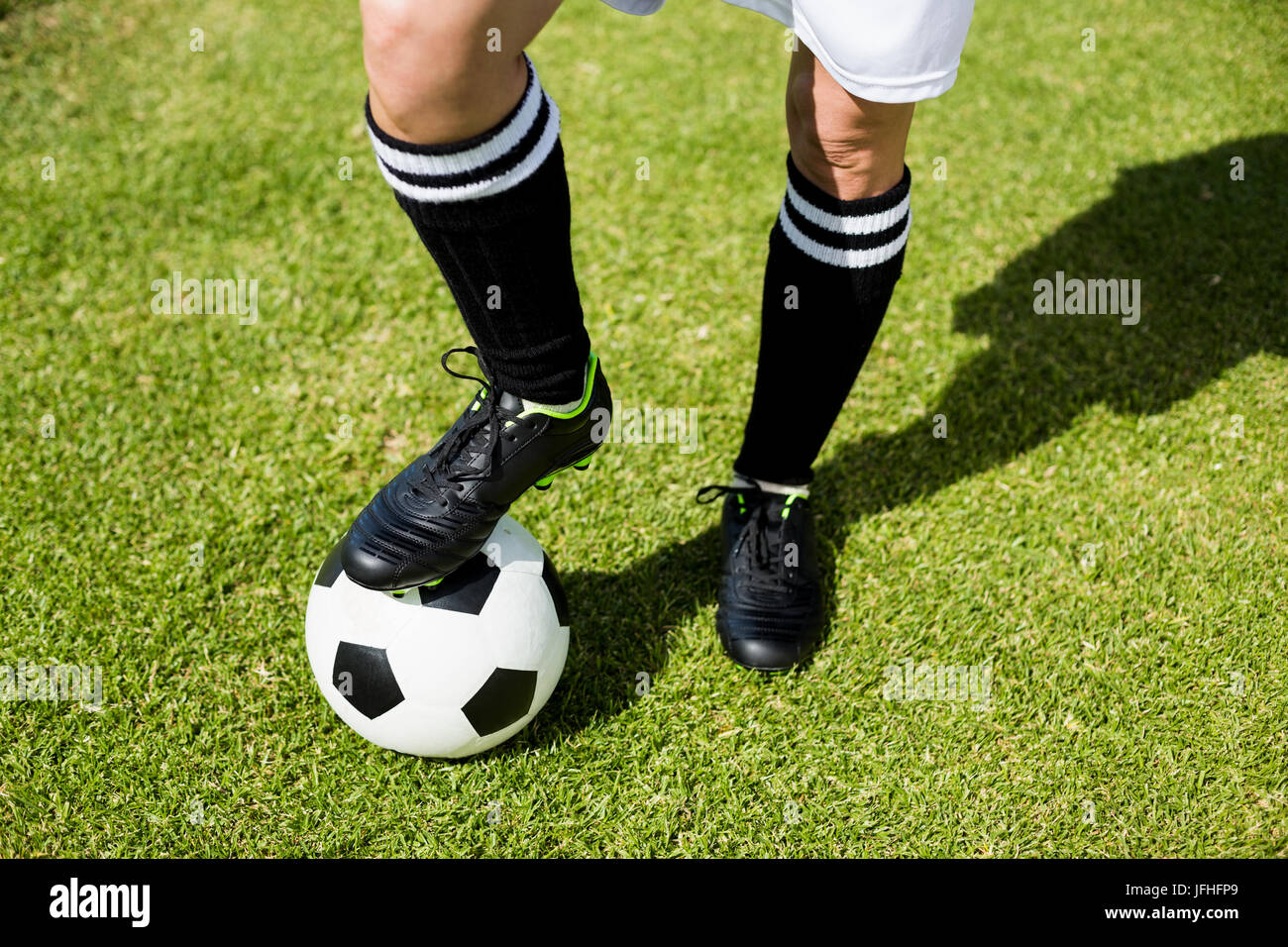 Soccer football player standing feet hi-res stock photography and ...