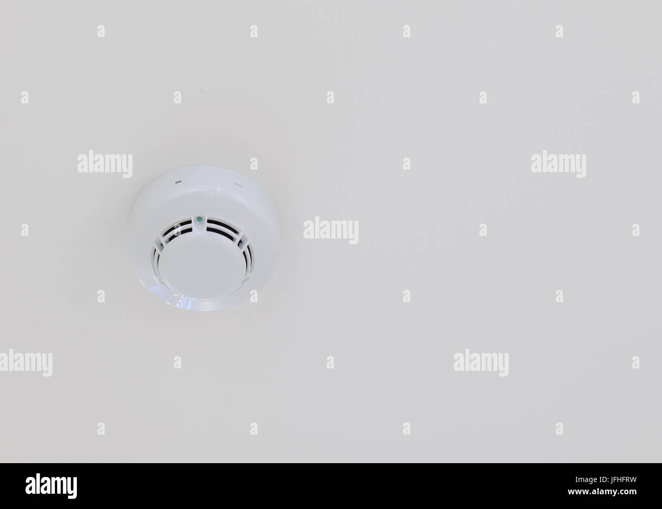 Smoke alarm on the ceiling Stock Photo - Alamy