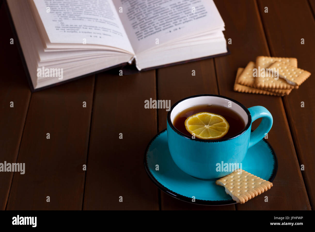 Cup of tea and books Stock Photo - Alamy