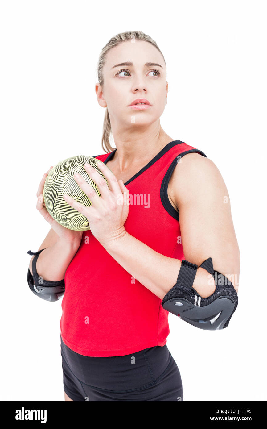 Female athlete with elbow pad holding handball Stock Photo - Alamy