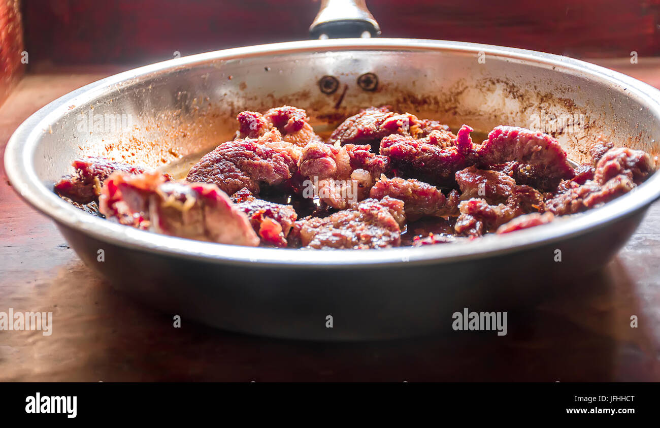 Delicious beef steak cooked in a stainless steel Stock Photo - Alamy