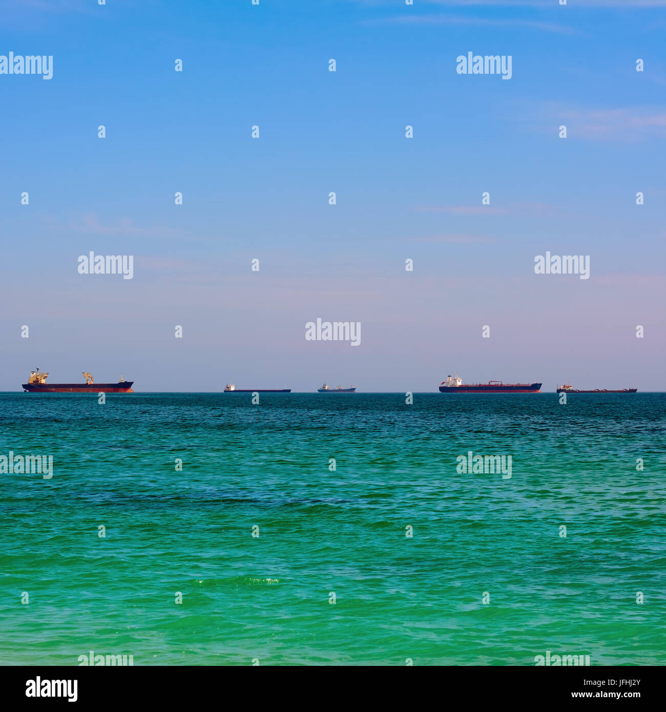Cargo ships sailing out sea hi-res stock photography and images - Alamy
