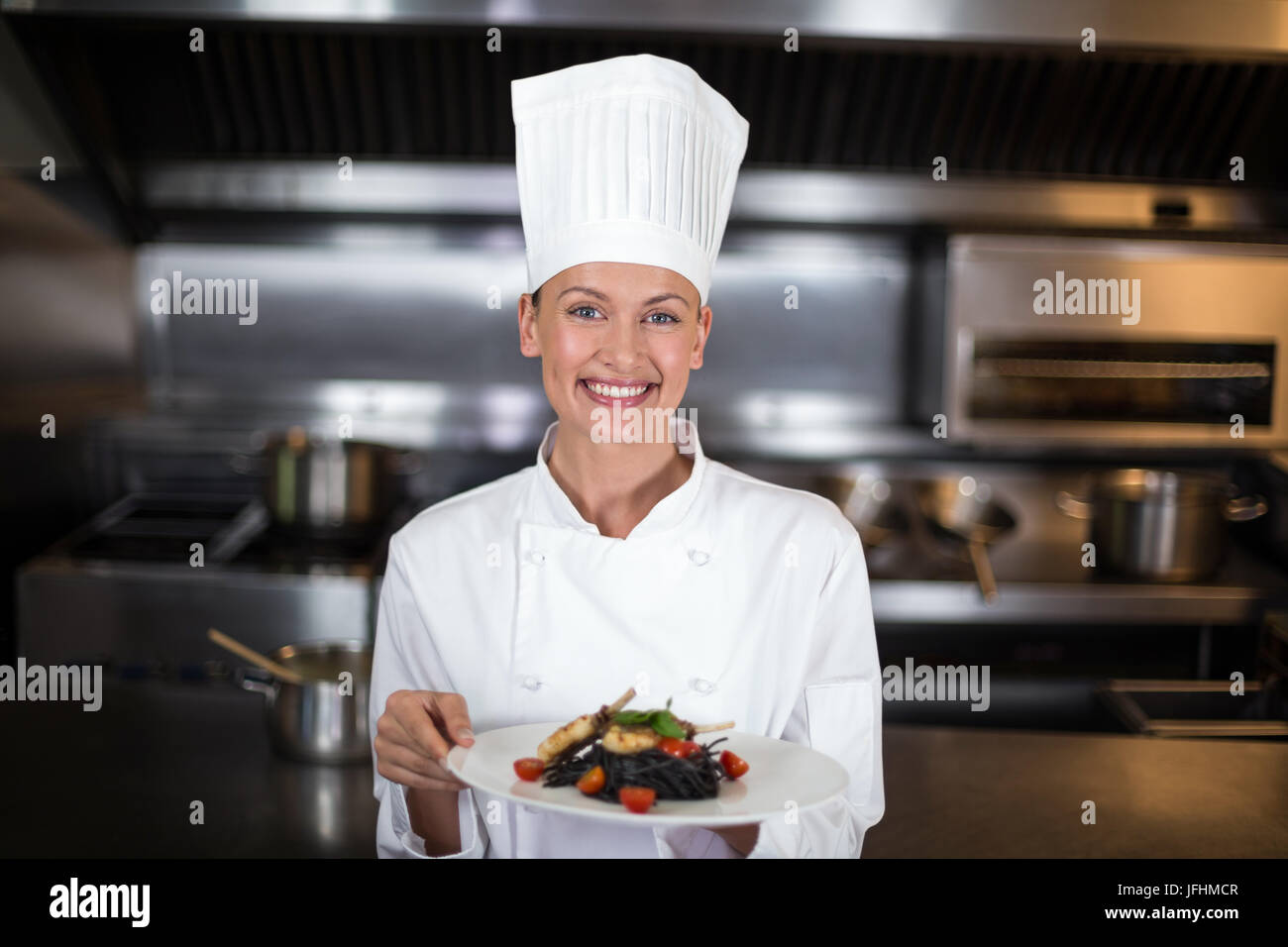 Portrait chef holding plate hi-res stock photography and images - Alamy