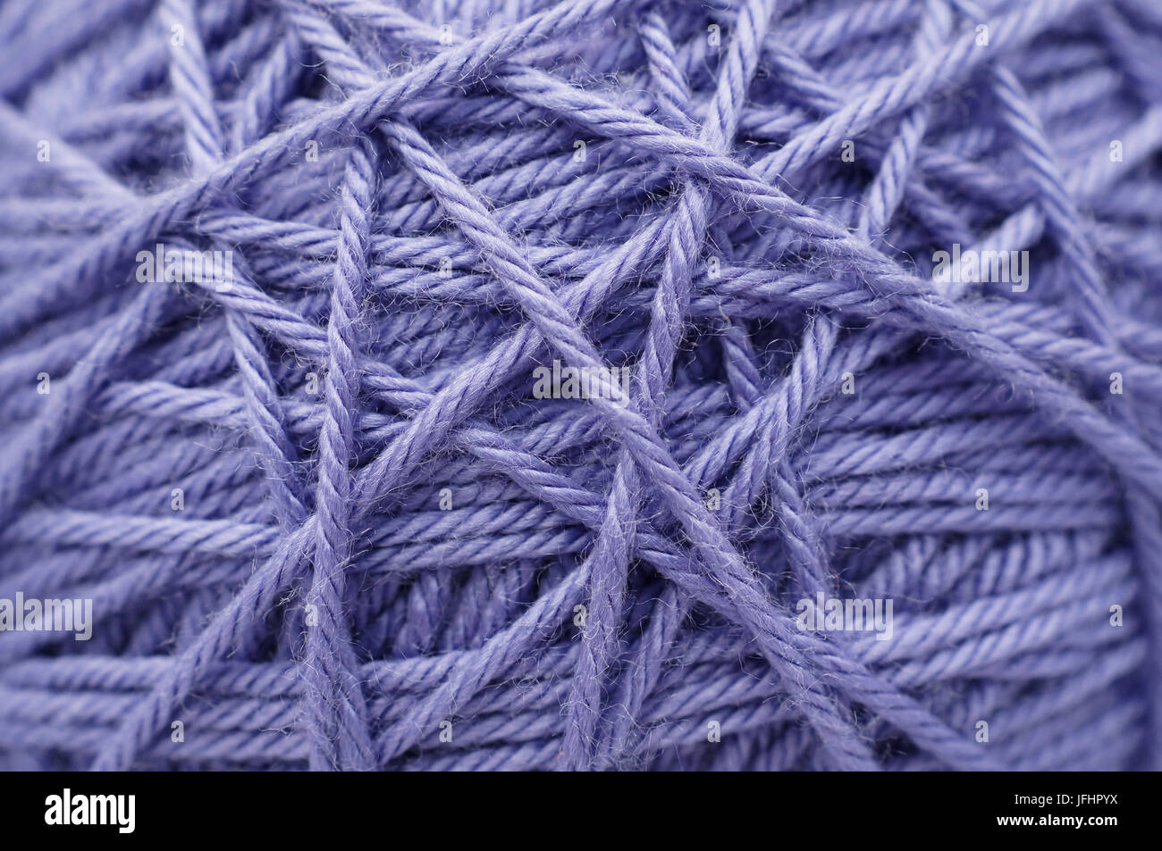 Ball of lilac yarn. Closeup texture Stock Photo - Alamy