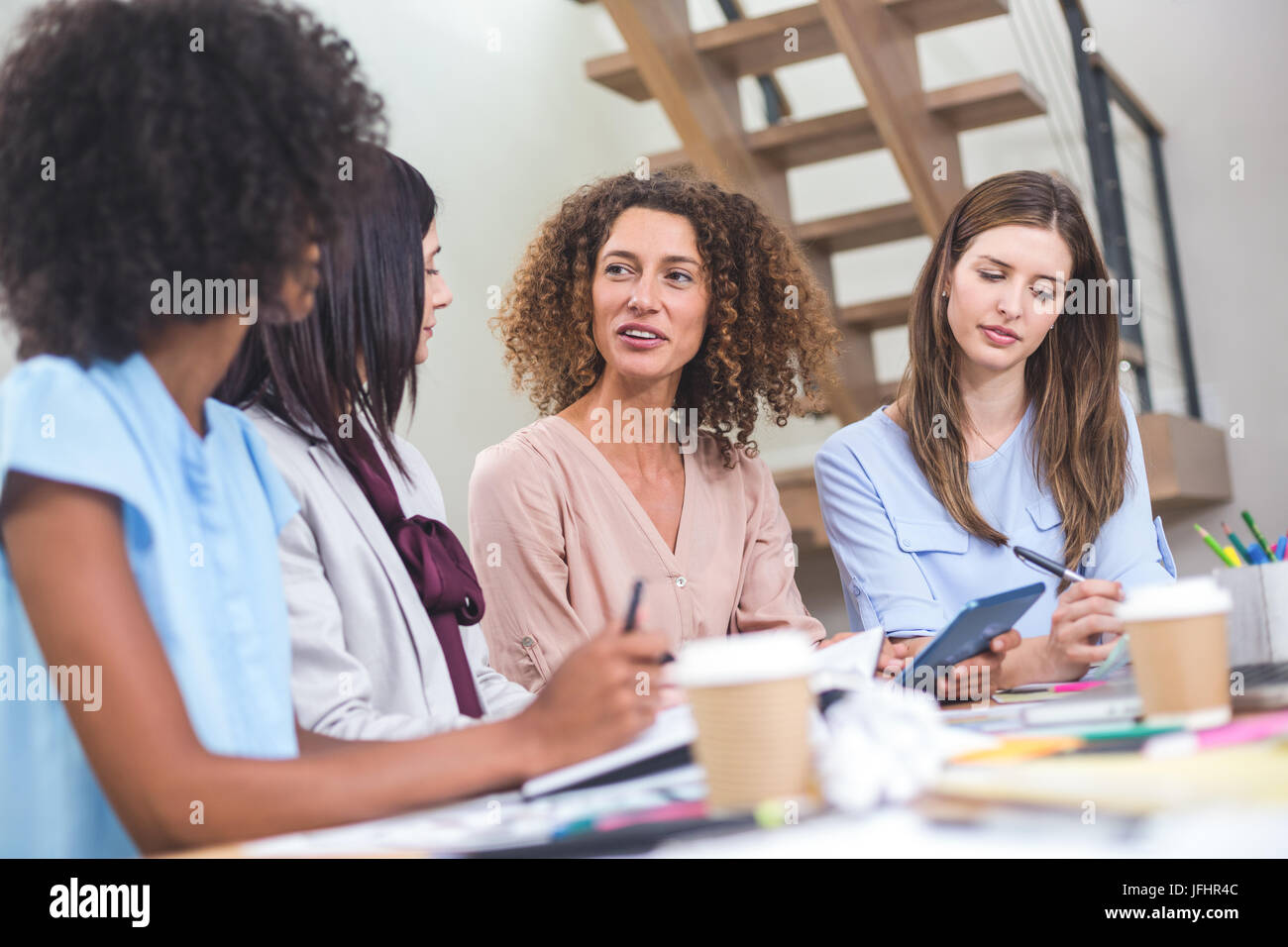 Group of interior designers interacting with each other Stock Photo - Alamy