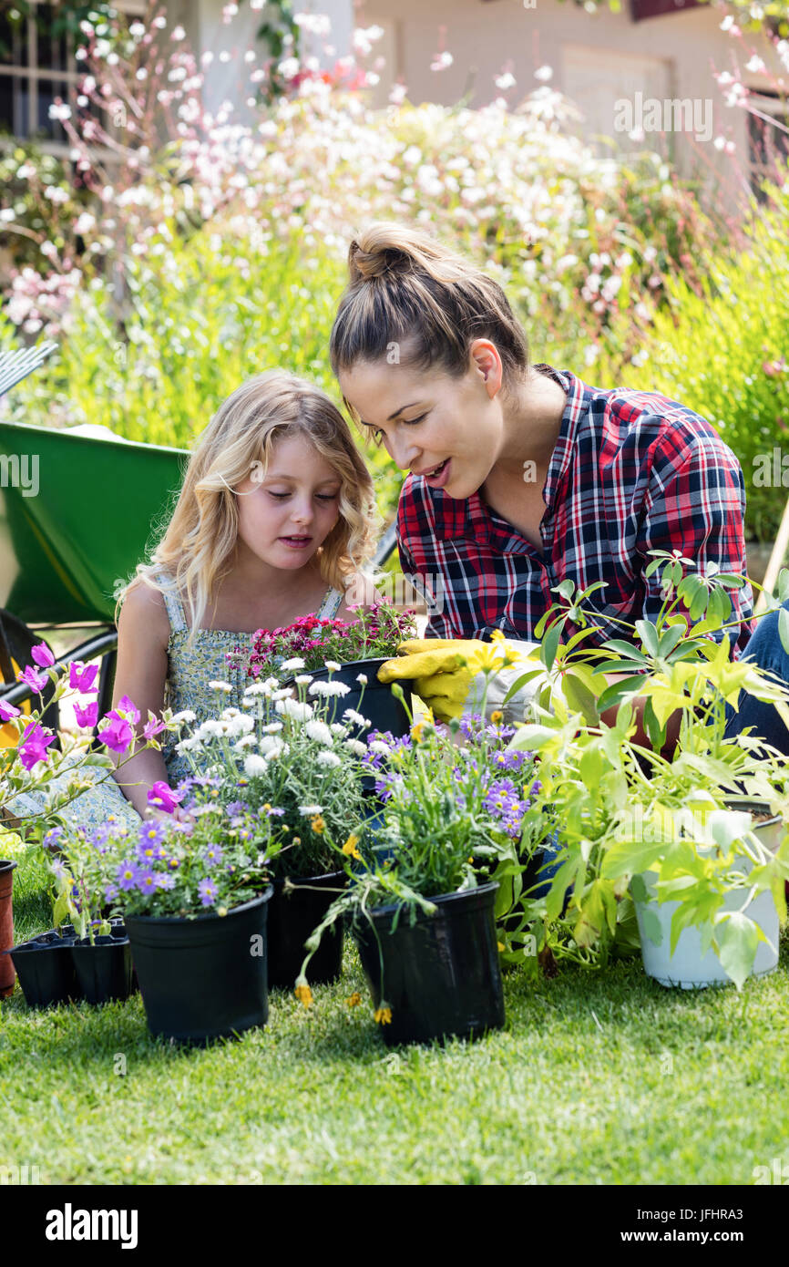 Mother and daughter gardening together in garden Stock Photo - Alamy