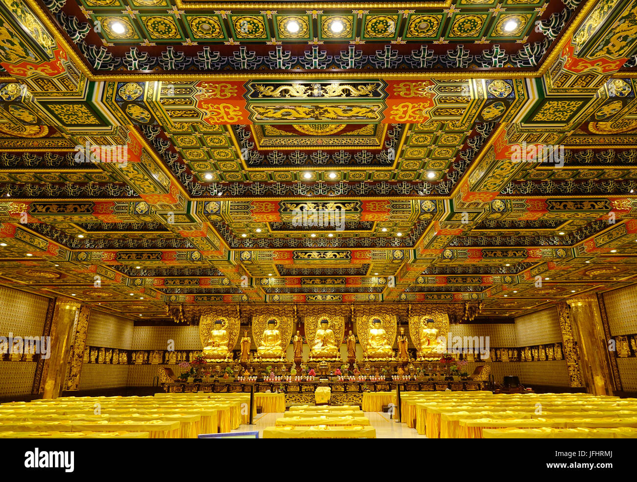 Hong Kong - Mar 31, 2017. Golden Buddha statues in interior of the ...