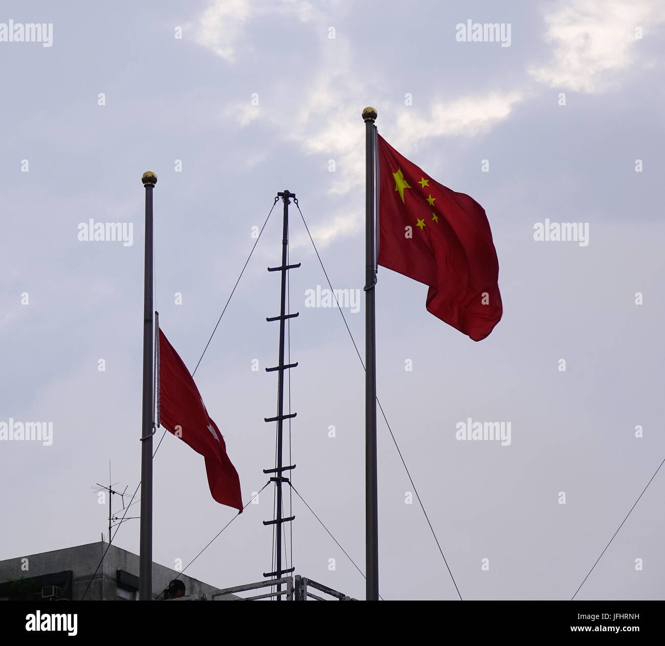 Chinese flag floating on the top of government building in Hong Kong ...