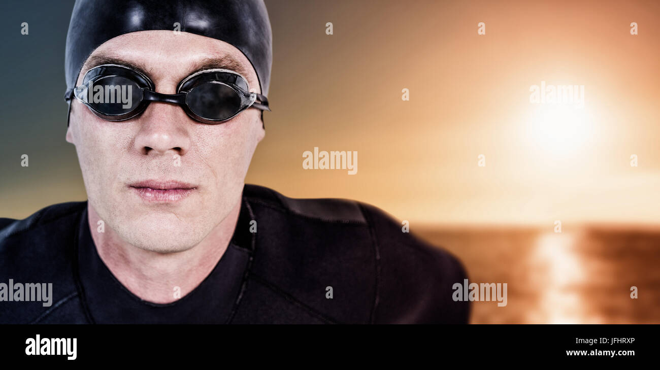 Composite image of close-up of confident swimmer in wetsuit Stock Photo ...