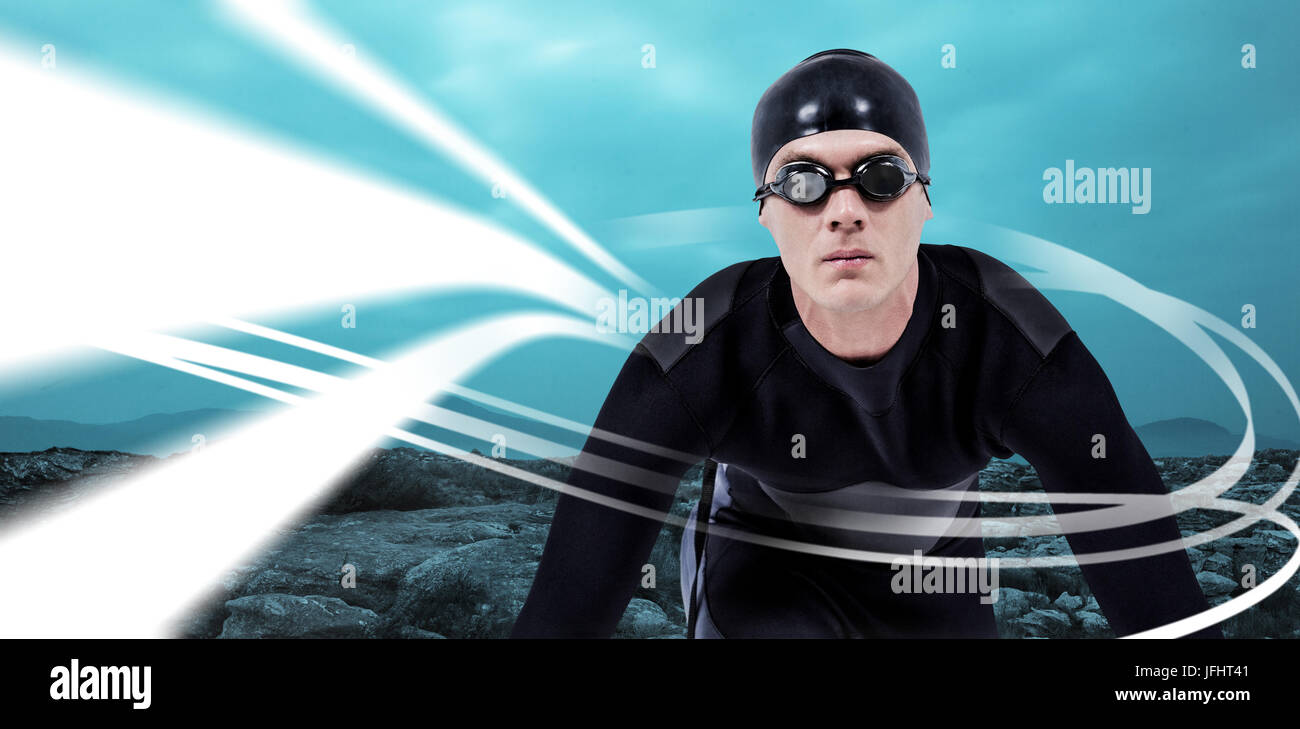 Composite image of confident swimmer in wetsuit Stock Photo - Alamy