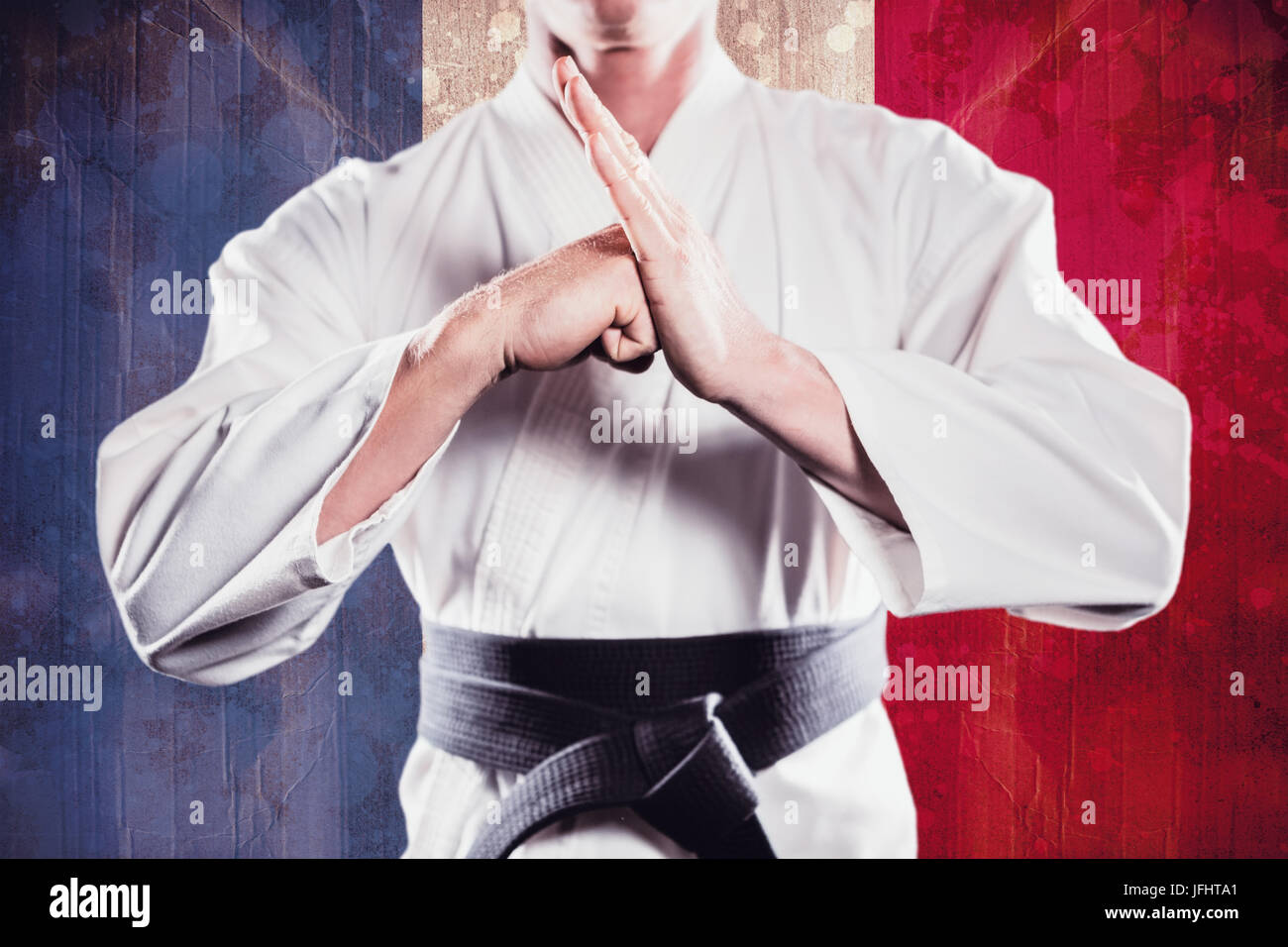 Composite image of fighter performing hand salute Stock Photo - Alamy