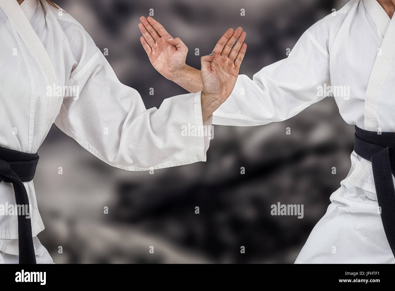 Composite image of female fighter performing karate stance Stock Photo ...