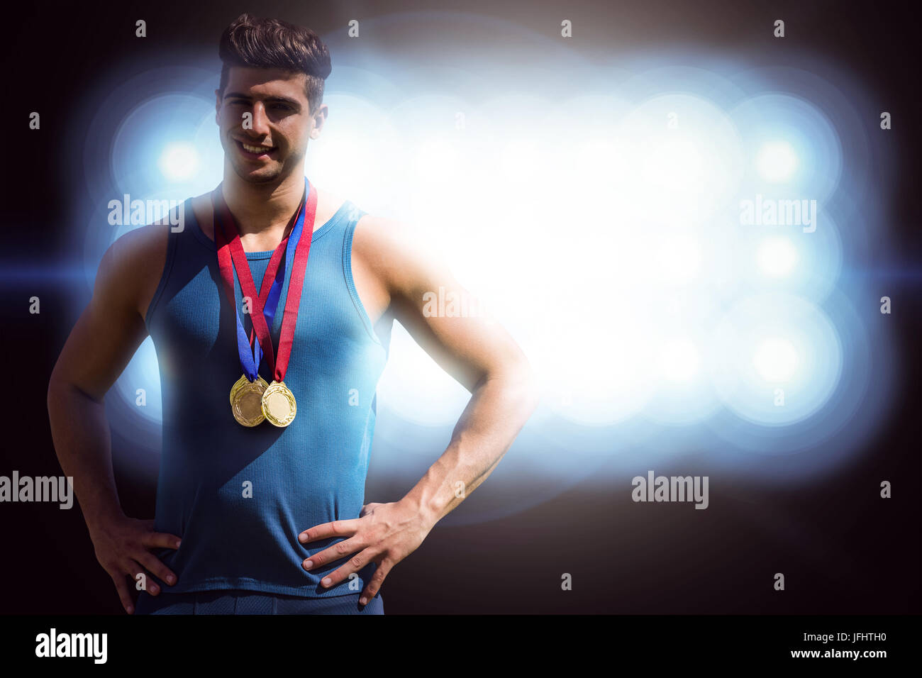 Composite image of portrait of athletic man holding medals Stock Photo ...