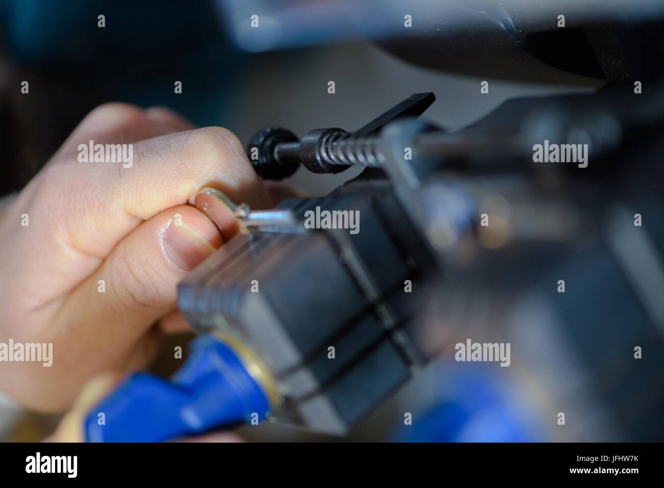 Closeup of key in machine Stock Photo - Alamy