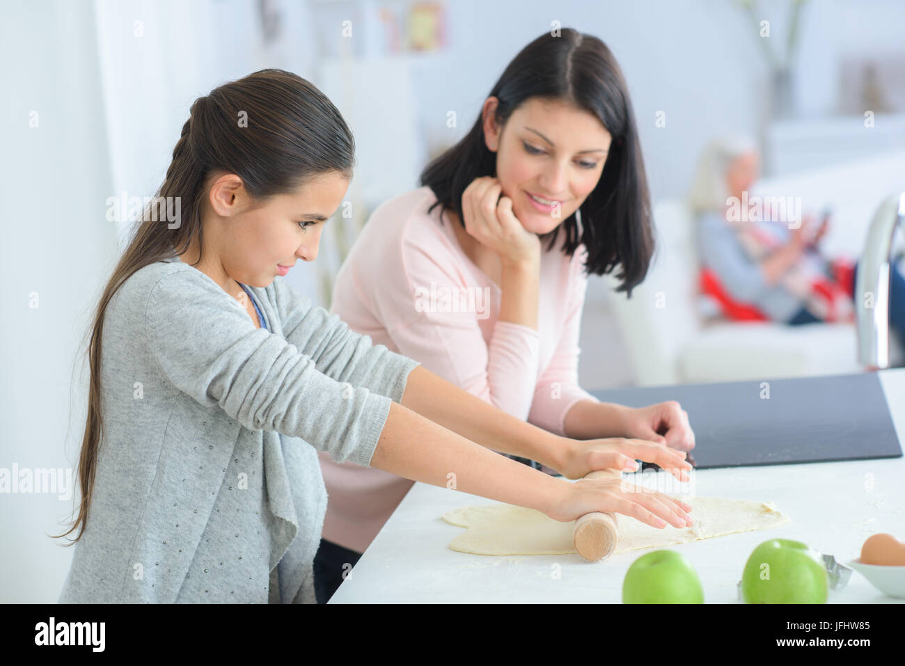 Sisters baking together Stock Photo - Alamy
