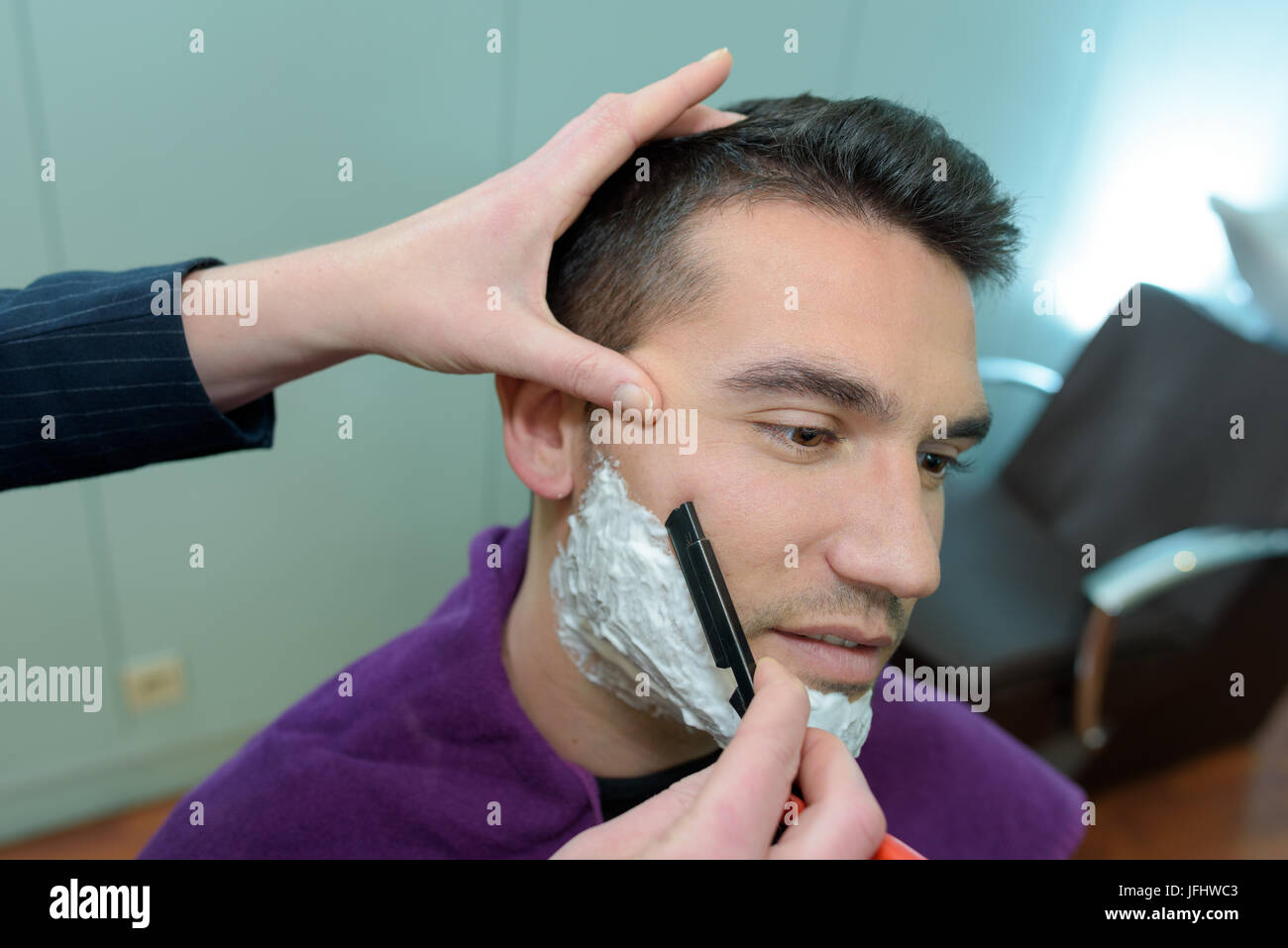 Barber shaving man Stock Photo - Alamy
