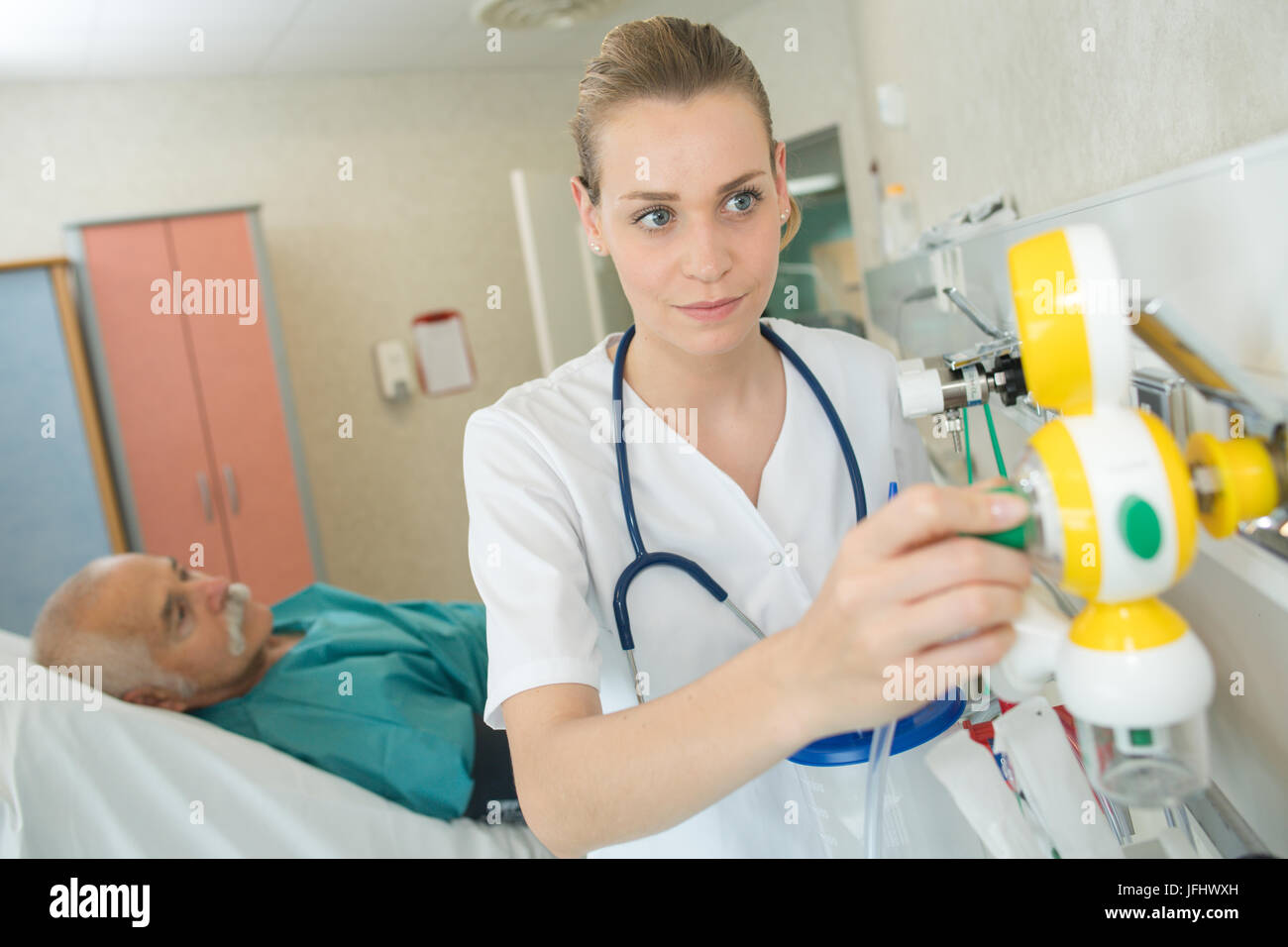 nurse adjusting the equipment Stock Photo - Alamy