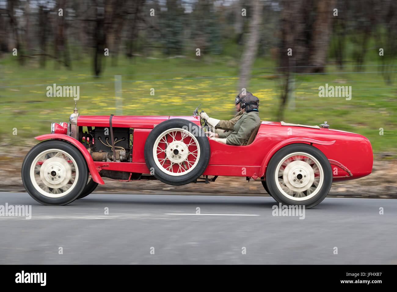 Vintage 1927 Standard 14/28 Boattail driving on country roads near the ...