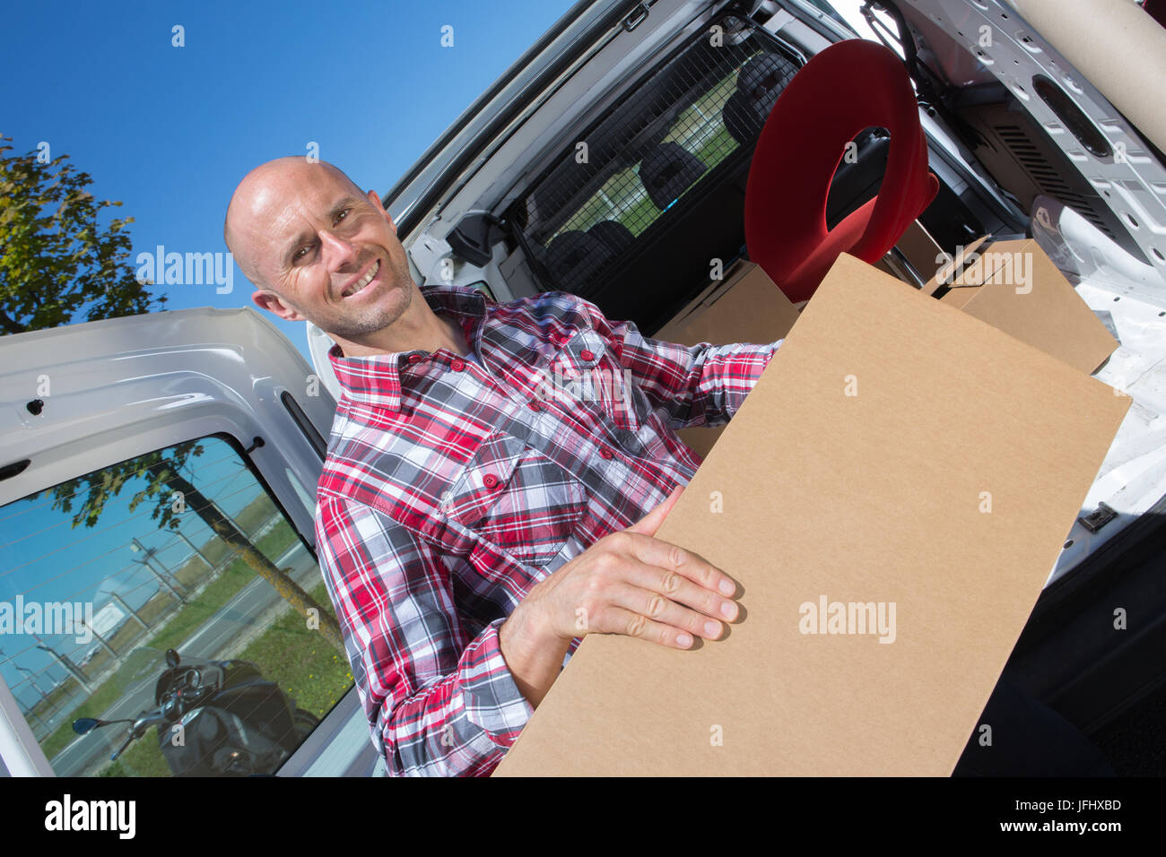 man holding a cardboard Stock Photo - Alamy