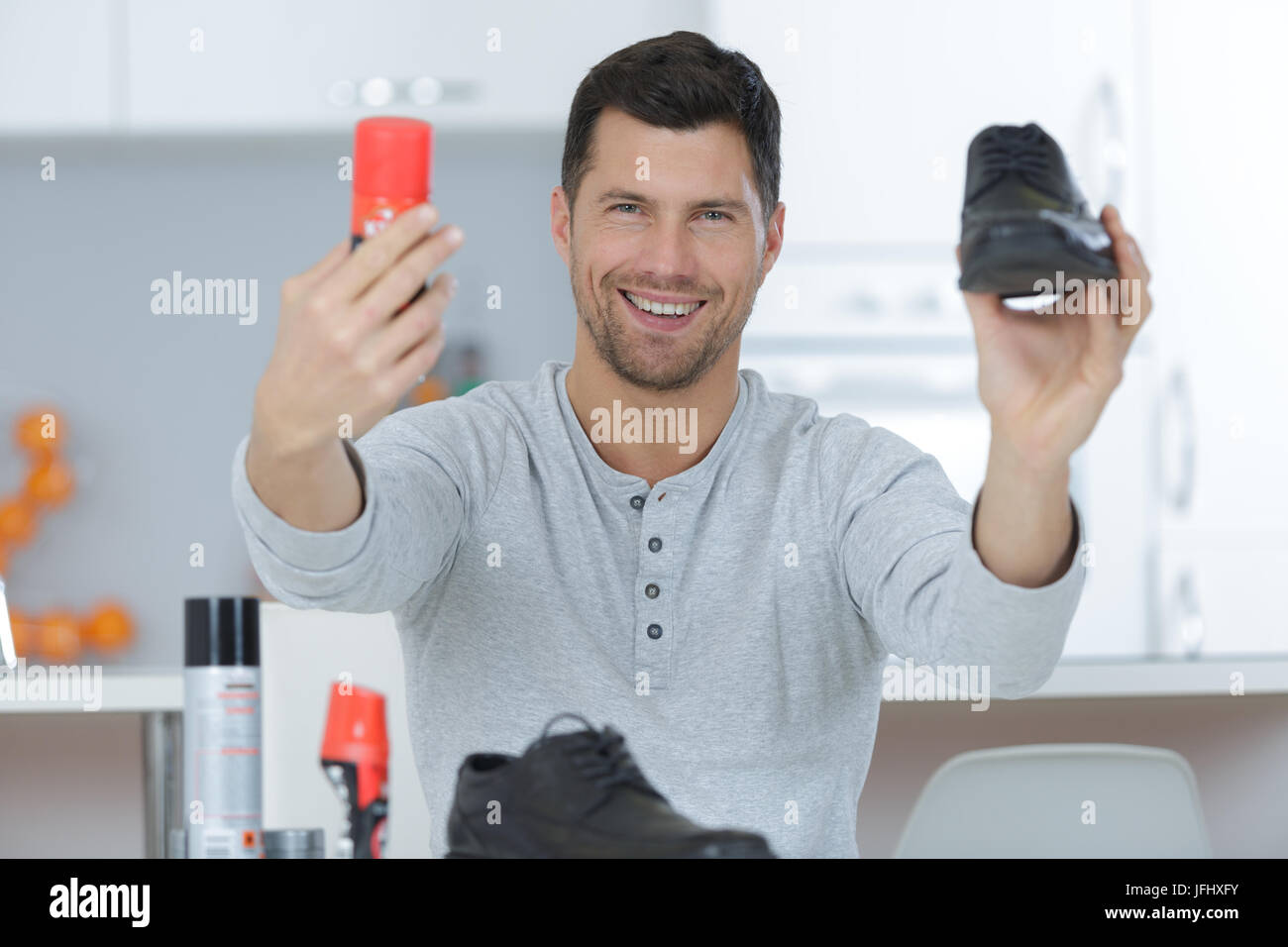happy man cleaning shoes Stock Photo - Alamy