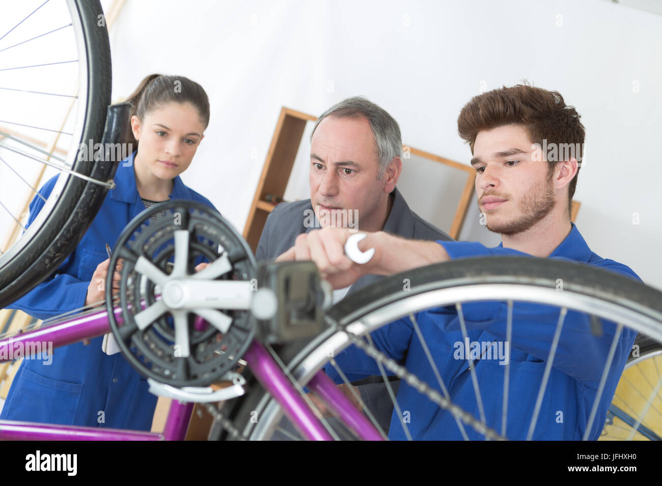 the bike assembling team Stock Photo - Alamy