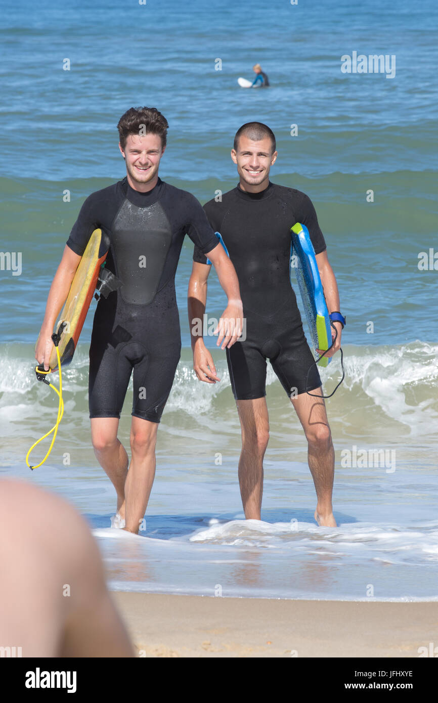 two boys surfing Stock Photo - Alamy
