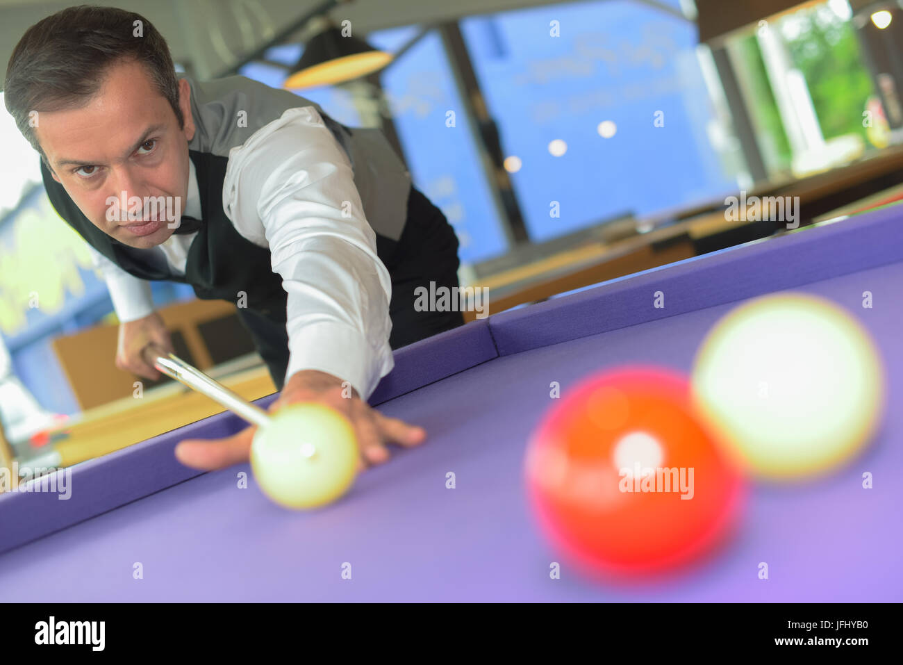 man playing billiards Stock Photo - Alamy