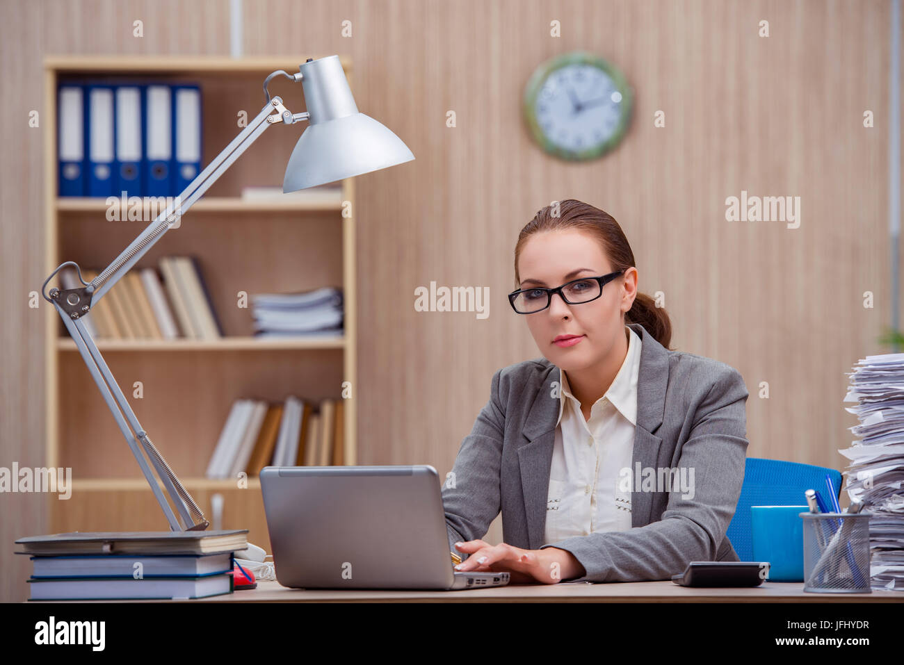 Busy stressful woman secretary under stress in the office Stock Photo ...