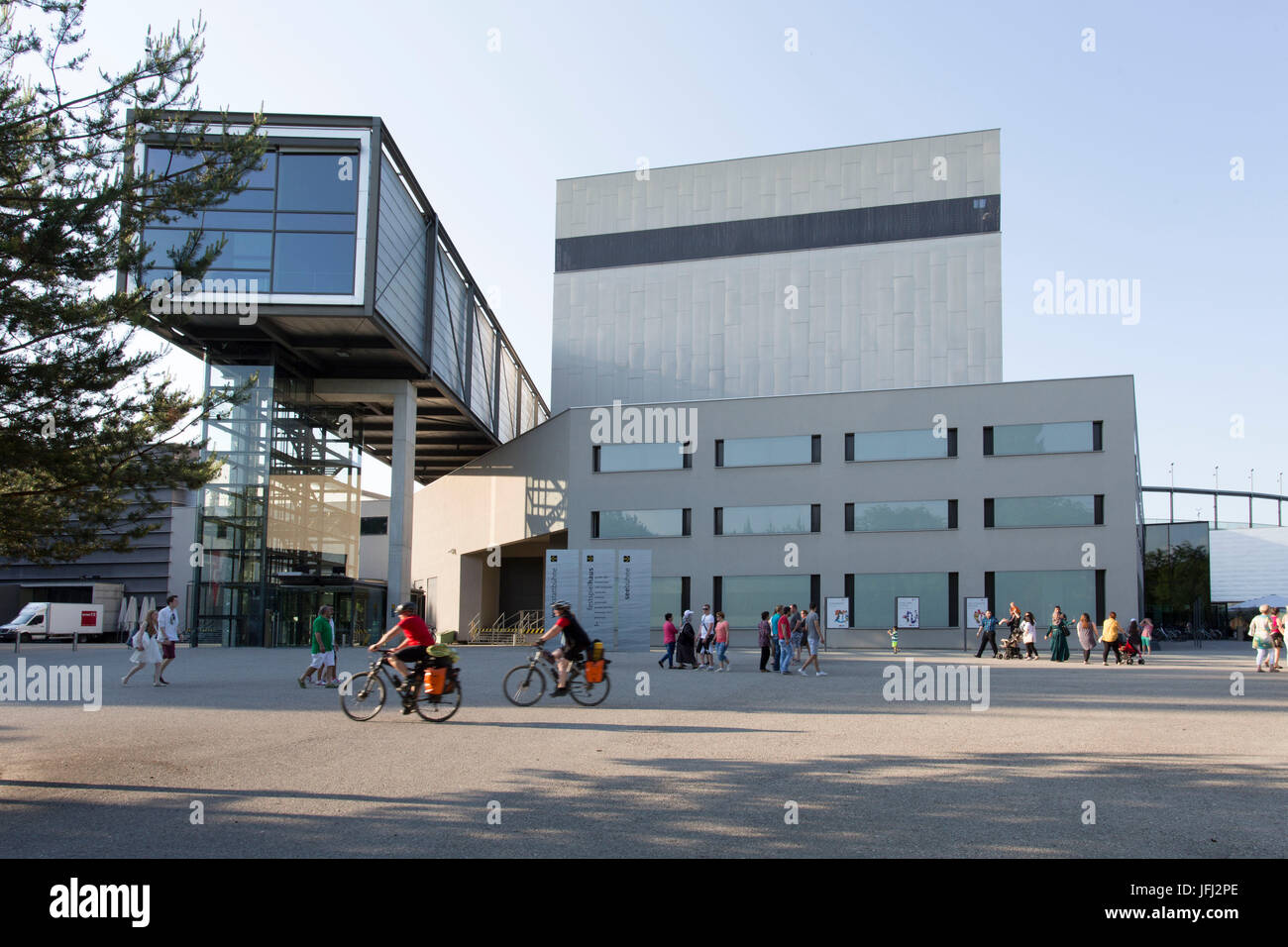 Festival performance house Bregenz, cyclist, stroller Stock Photo - Alamy