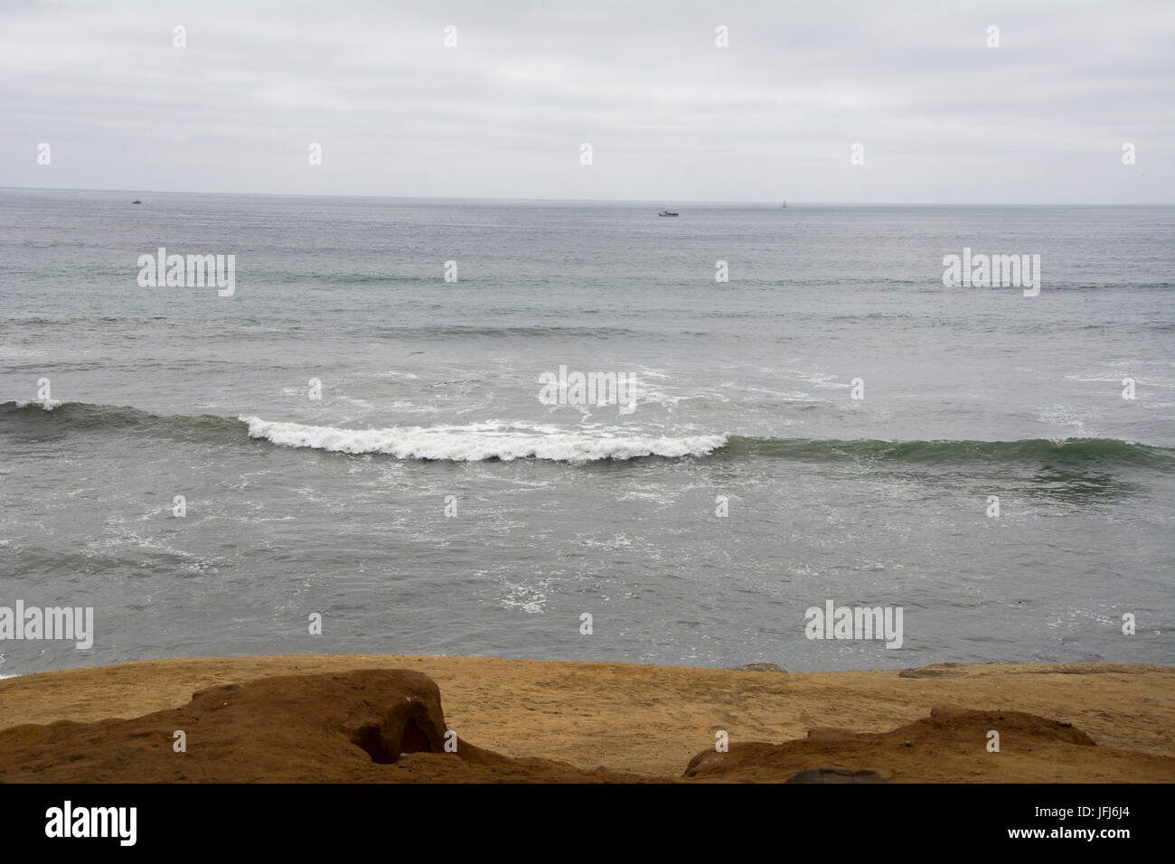 A cloudy and very overcast day on a beach Stock Photo - Alamy