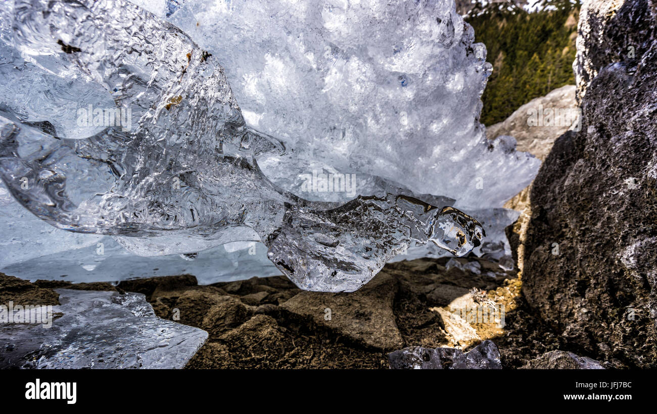 ice pieces in the Obernberger lake in winter, with Obernberg at the ...