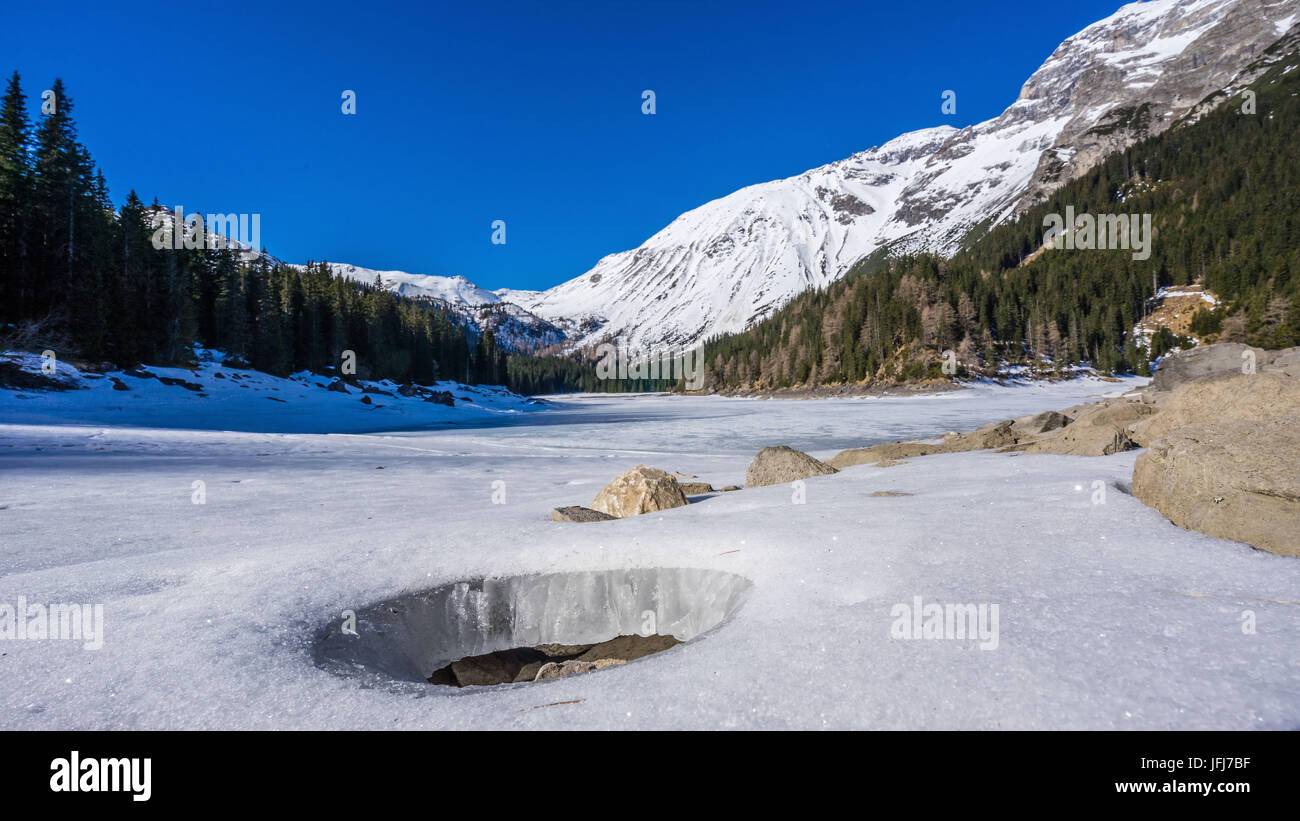 Obernberger lake in winter, with Obernberg at the Brenner Pass, the ...