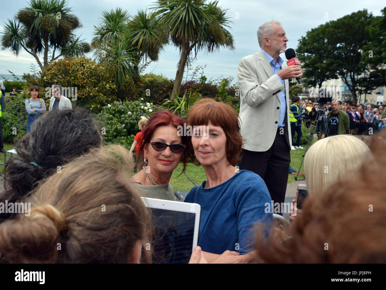 Supporters pose for a photo as Labour leader Jeremy Corbyn addresses a ...