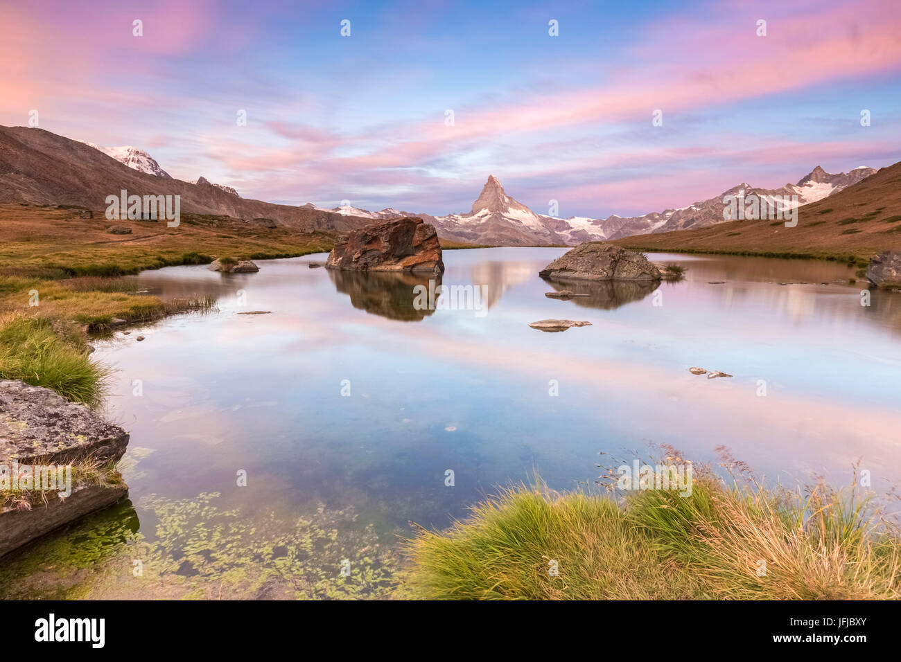 Dawn at Stellisee Lake with the Matterhorn reflecting, Zermatt ...