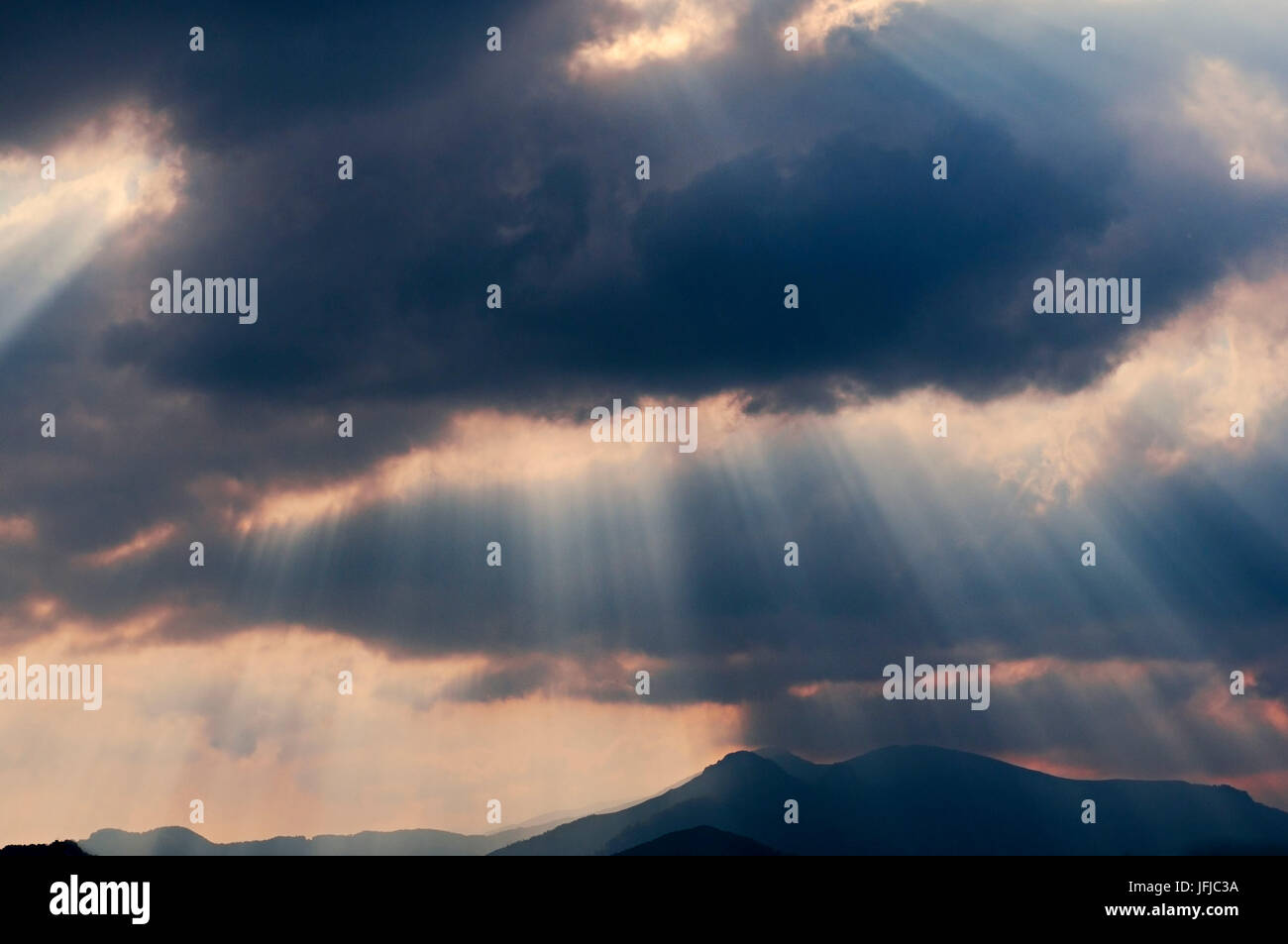 Italy, Piedmont, Cuneo District, Ray light over Alpe di Rittana Stock ...