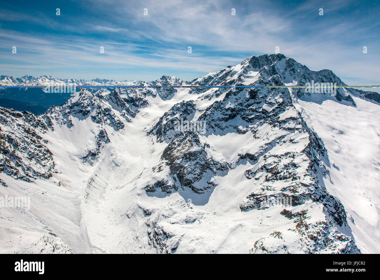 Aerial view of the pyramid of Mount Disgrazia in winter with the ...