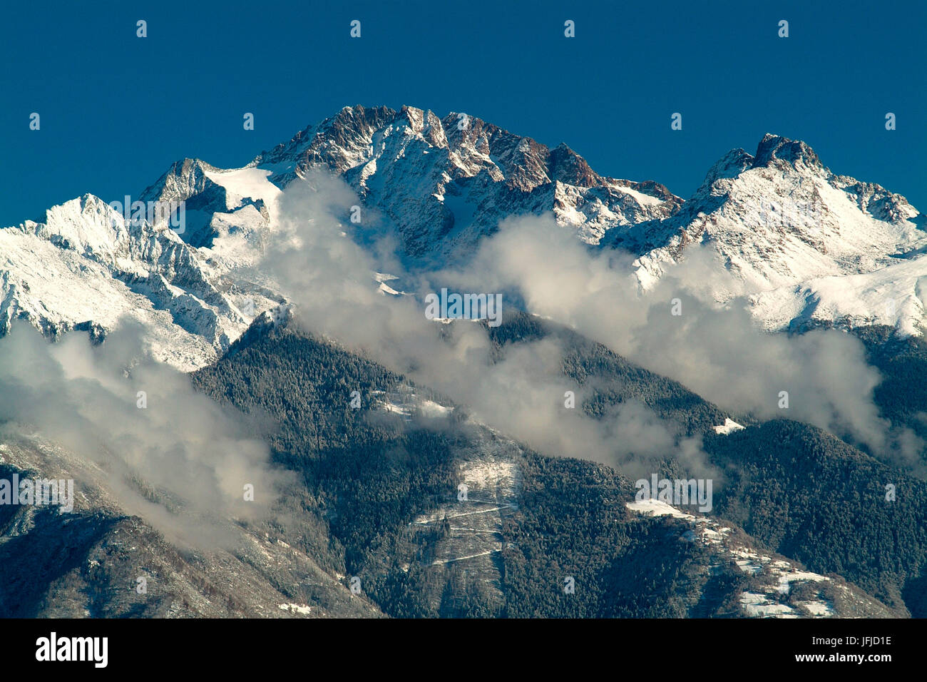 Mount Disgrazia and the peaks surrounding it capped by a winter ...