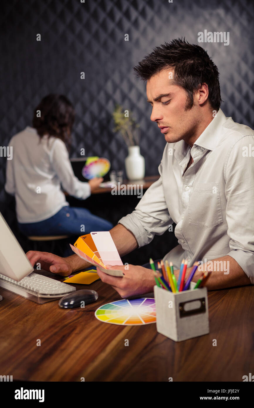 Creative businessman working with colour samples Stock Photo - Alamy