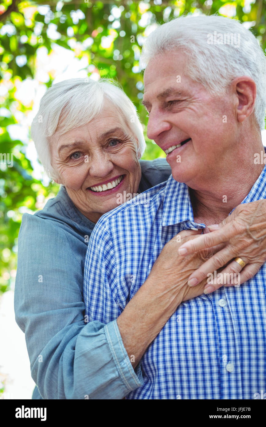 Cheerful retired couple hugging Stock Photo - Alamy