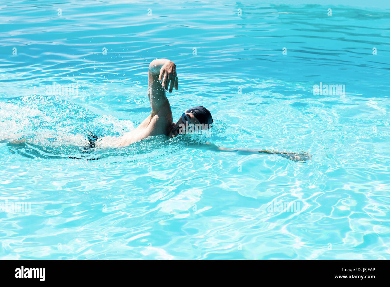 Fit swimmer doing the front crawl Stock Photo - Alamy