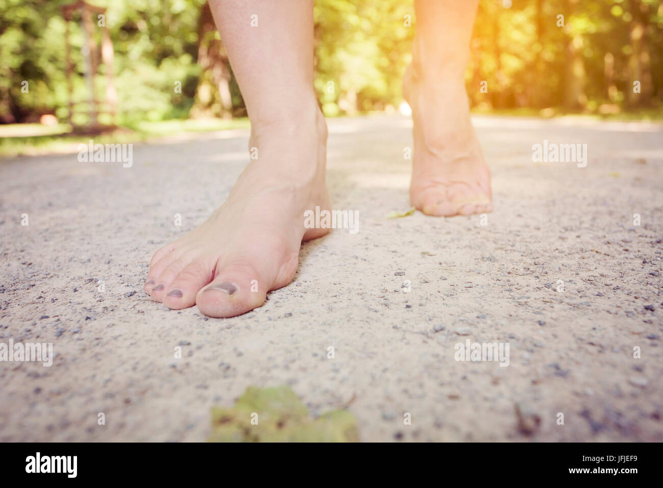 Female barefoot legs walking in nature Stock Photo - Alamy