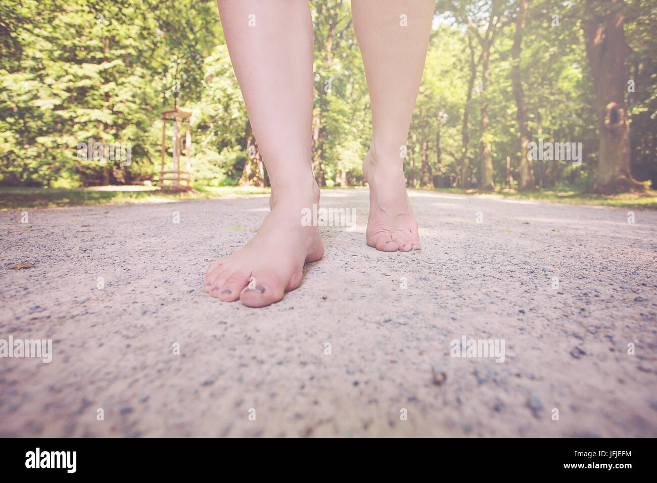 Female barefoot legs walking in nature Stock Photo - Alamy