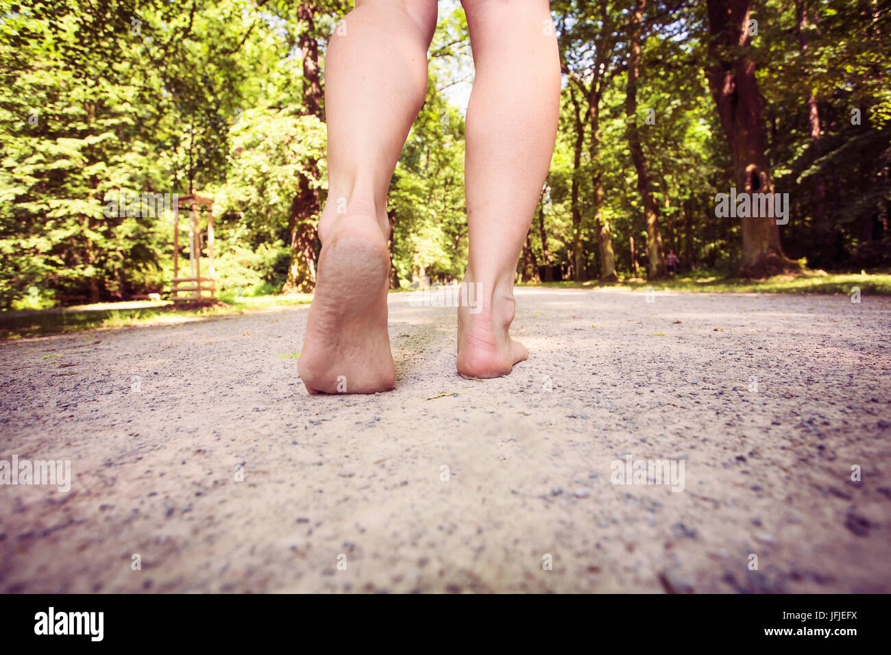 Female barefoot legs walking in nature Stock Photo - Alamy